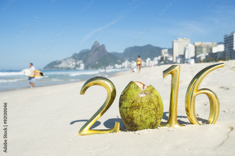 Gold 2016 message with green coco gelado drinking coconut on the beach ...
