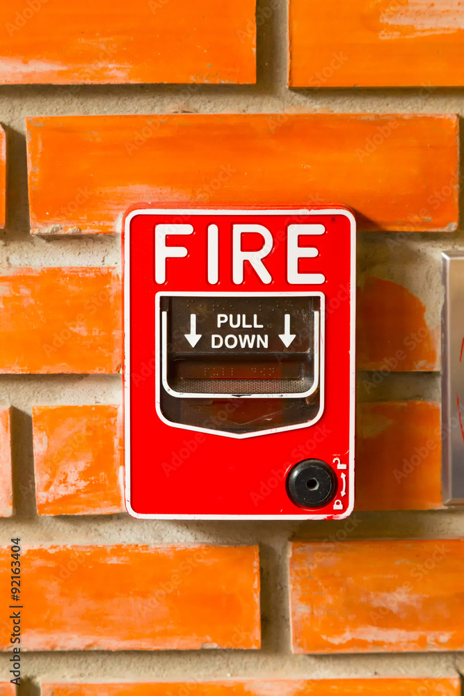Fire Alarm Switch on the orange brick wall background texture. Stock ...