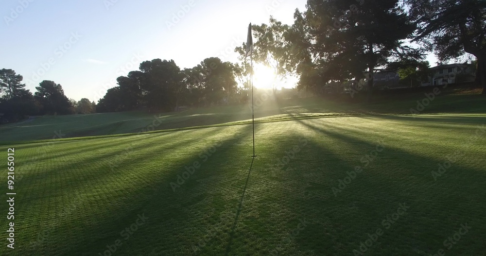 Motion golf course flagstick dramatic beautiful sun rays light shadow ...