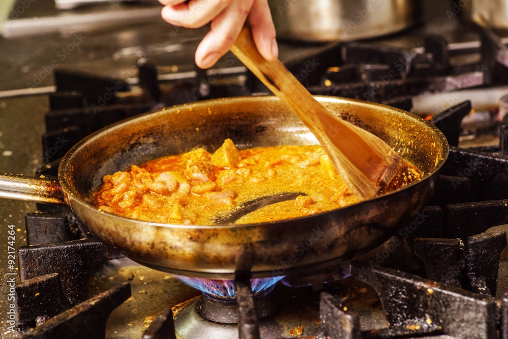 Steaming food in the frying pan Stock Photo | Adobe Stock