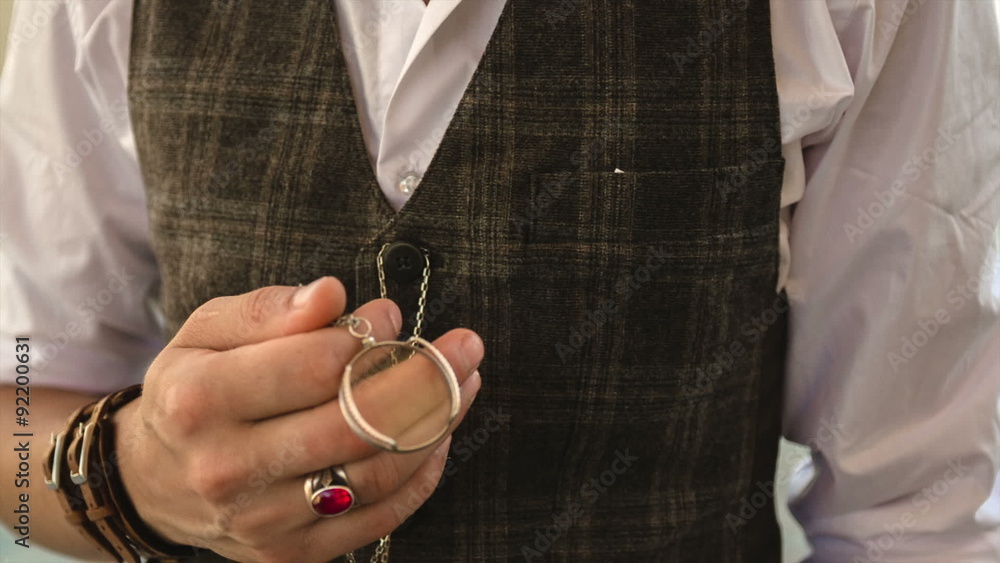 man holding a monocle in his hand. Stock Video | Adobe Stock