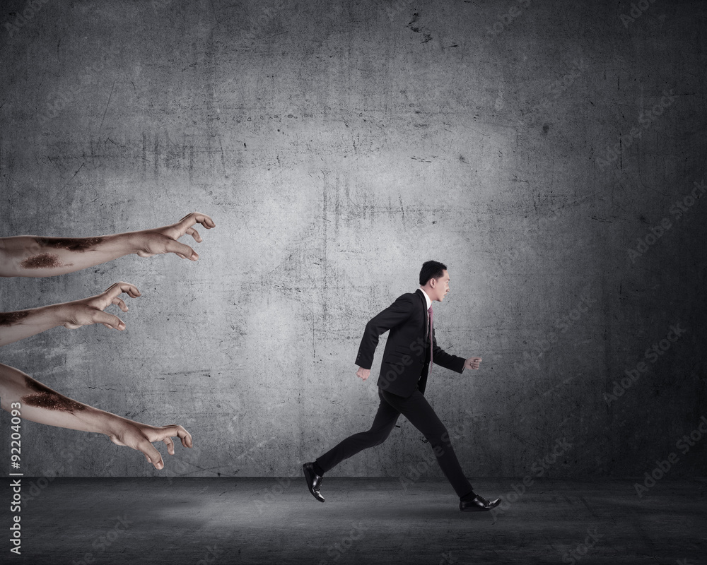 Business man running with zombie Stock Photo | Adobe Stock