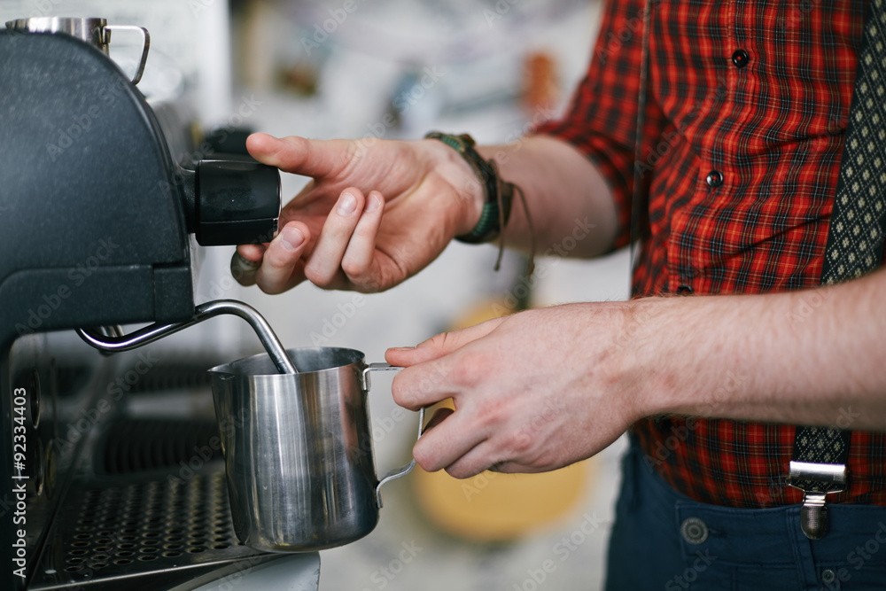 Using coffee machine Stock Photo | Adobe Stock