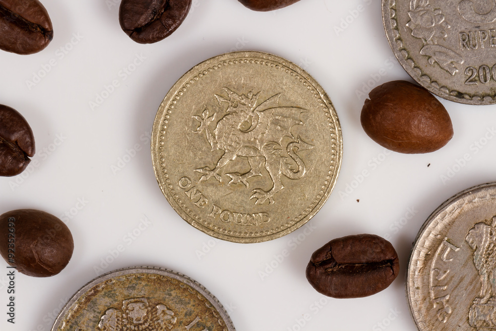 British coin. One pound. British coin. One pound and roasted coffee ...
