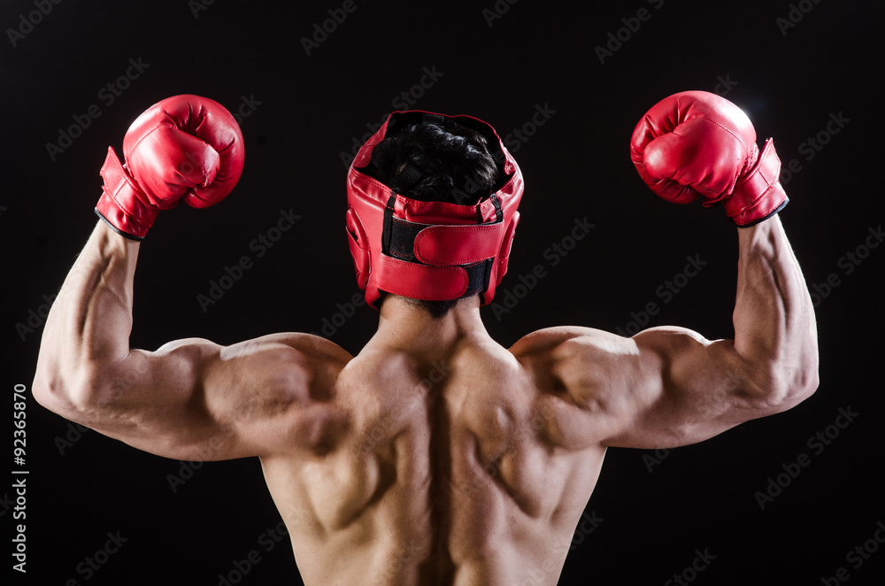 Muscular man in boxing concept Stock Photo | Adobe Stock