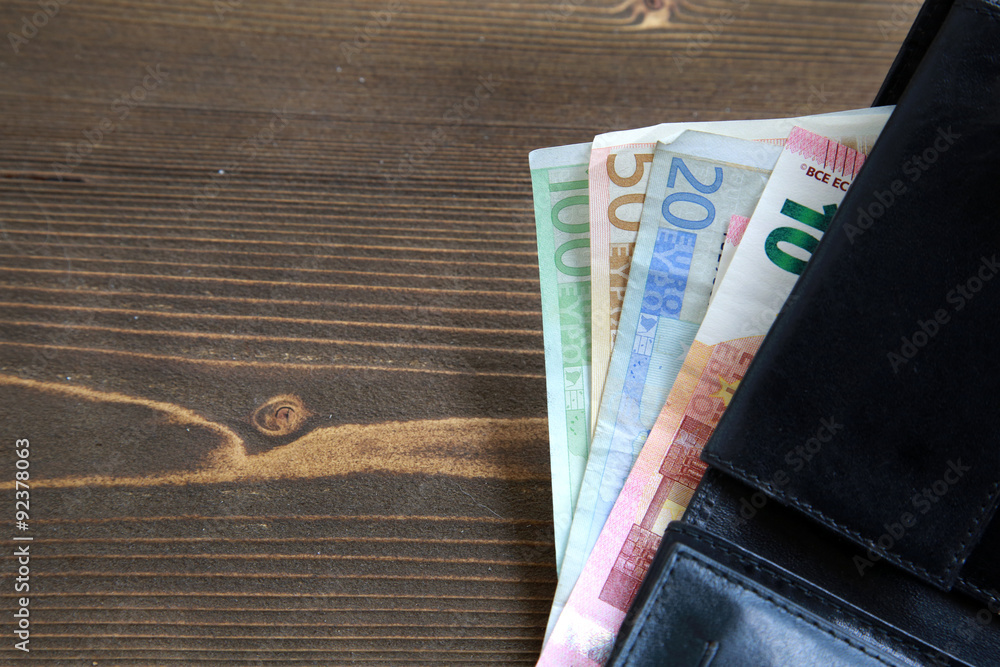 Euro bank notes sticking out of wallet Stock Photo | Adobe Stock