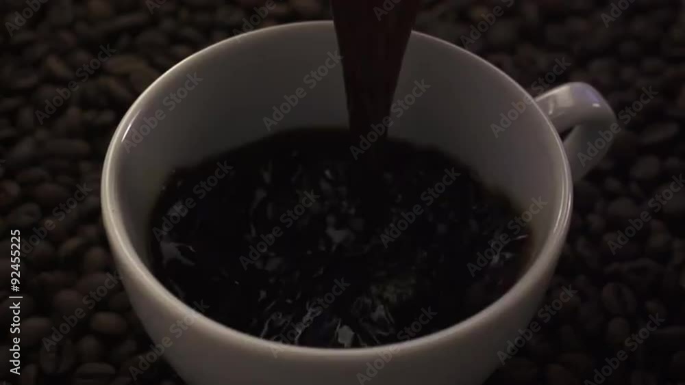 pouring black coffee on dark background Stock Video | Adobe Stock