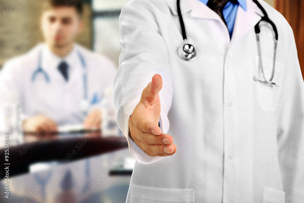 Doctor giving his hand for a handshake Stock Photo | Adobe Stock