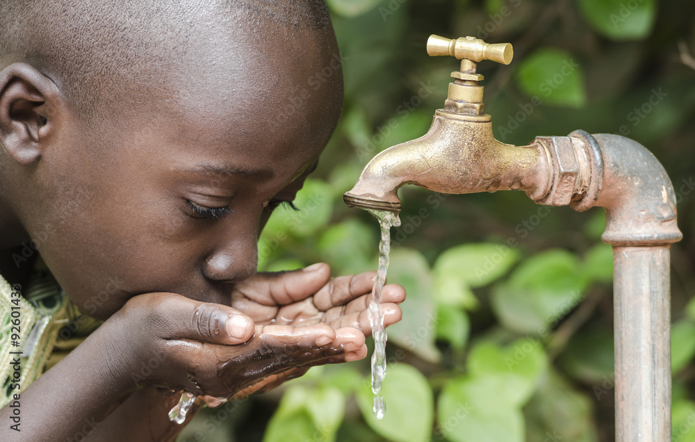 Proud Black Boy Drinking from a Water Tap Africa Stock Photo | Adobe Stock