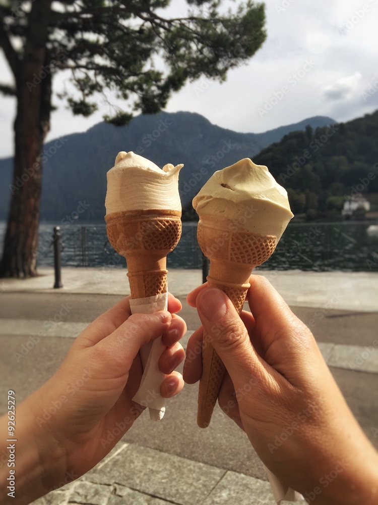 two hands holding two ice cream cones Stock Photo | Adobe Stock
