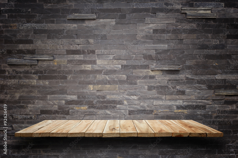 Empty wooden shelves and stone wall background. For product disp Stock ...