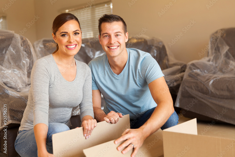 Young Couple Unpacking Boxes Stock Photo Adobe Stock