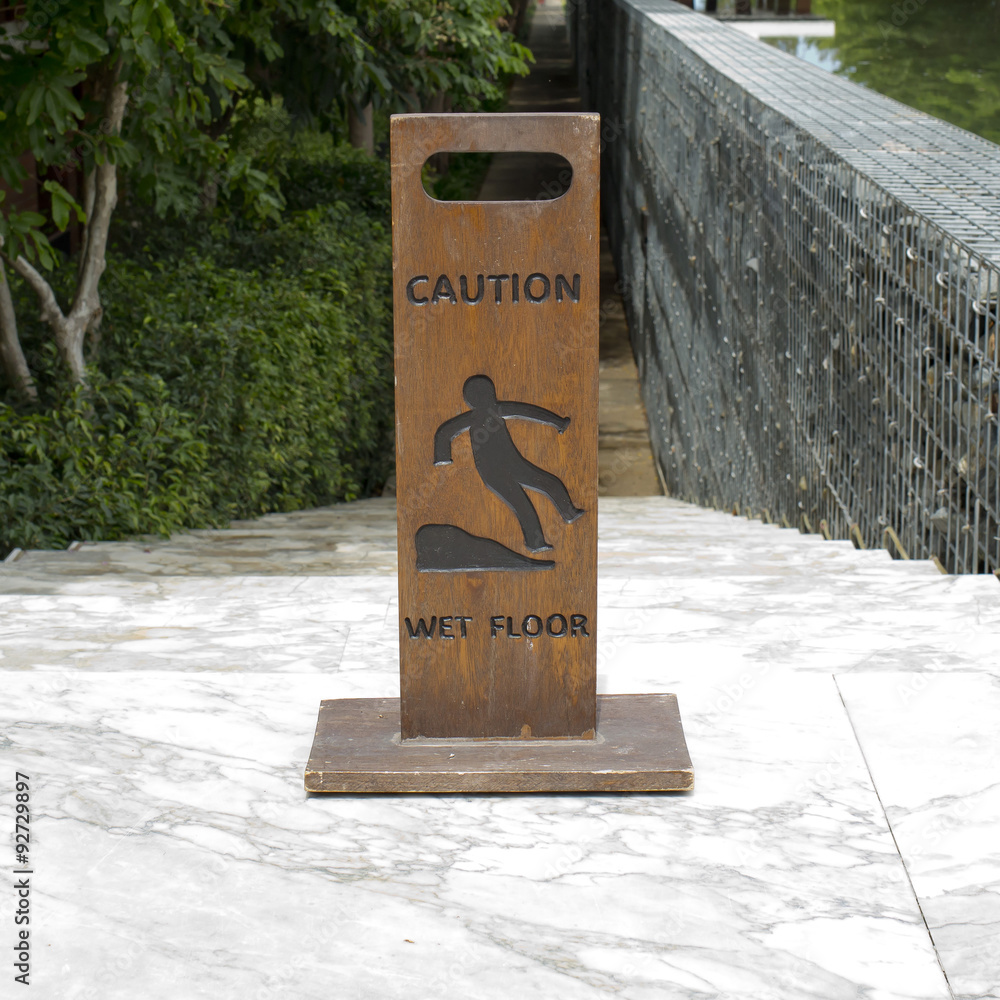 Caution wet floor wooden sign board Stock Photo | Adobe Stock