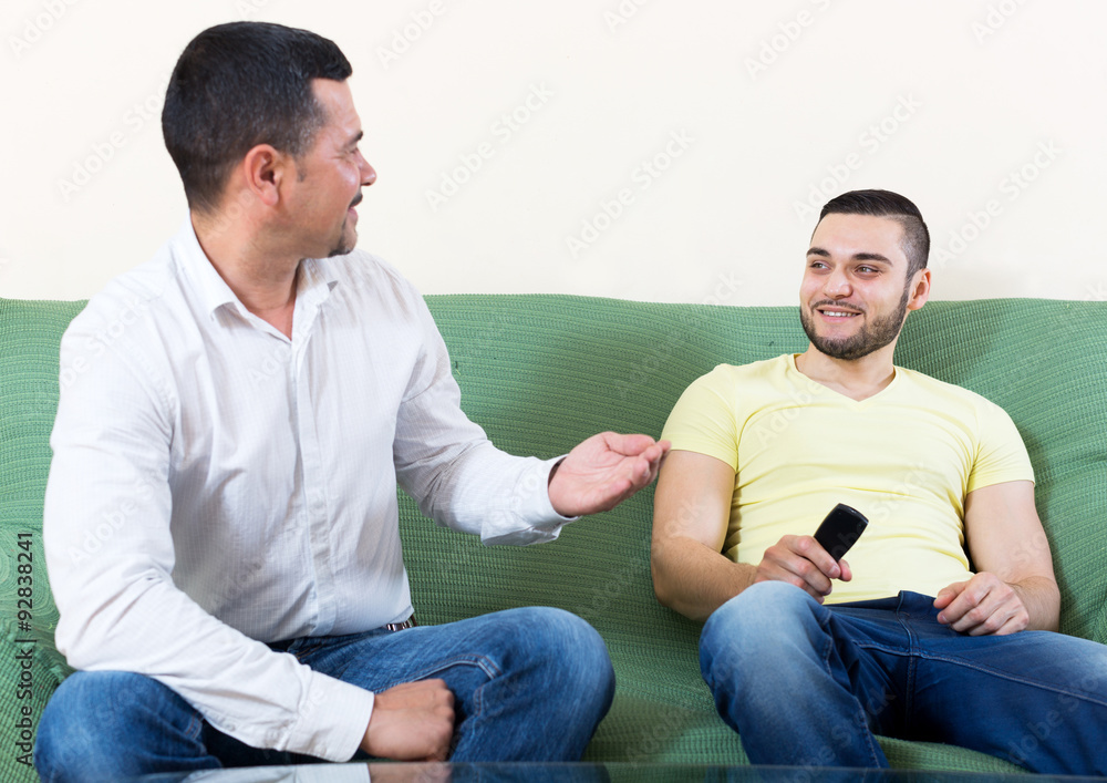 Two men talk Stock Photo | Adobe Stock