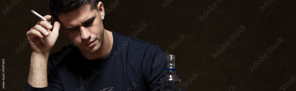 Addicted man on black background Stock Photo | Adobe Stock