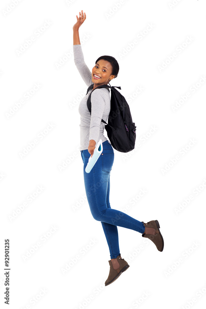 young female african college student jumping Stock Photo | Adobe Stock