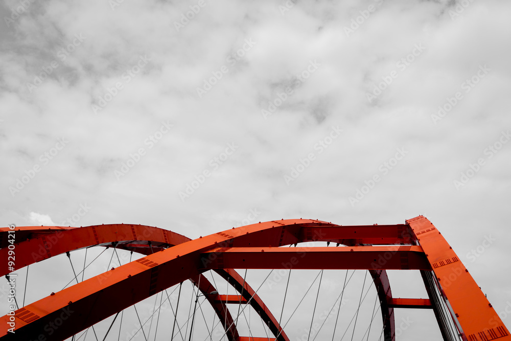 The steel construction of red bridge on a monochromatic background ...