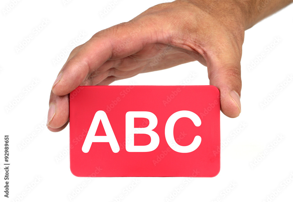 Hand holding and showing a red card with " ABC " text Stock Photo ...