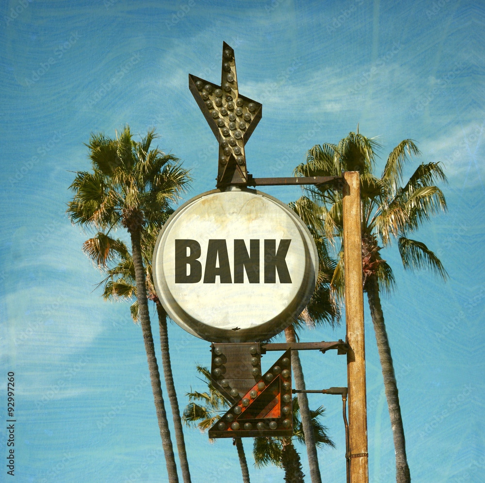 aged and worn vintage photo of bank sign with palm trees Stock Photo ...