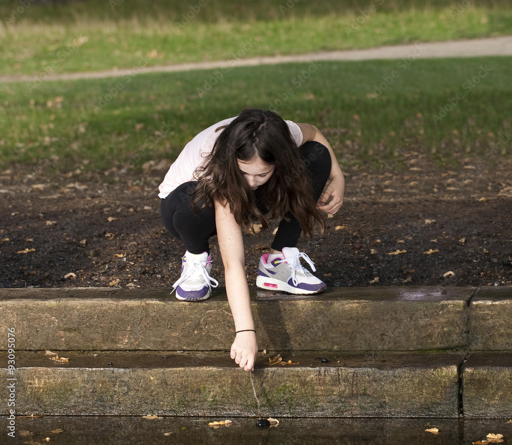 I'll Have that Conker. A young girl is reaching for a conker that is ...