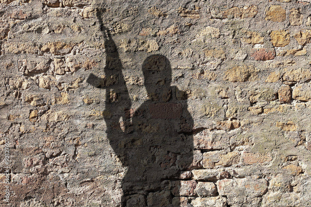 Shadow of man holding rifle Stock-Foto | Adobe Stock