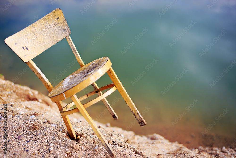 unstable precarious position. chair on the edge of the crumbling high ...