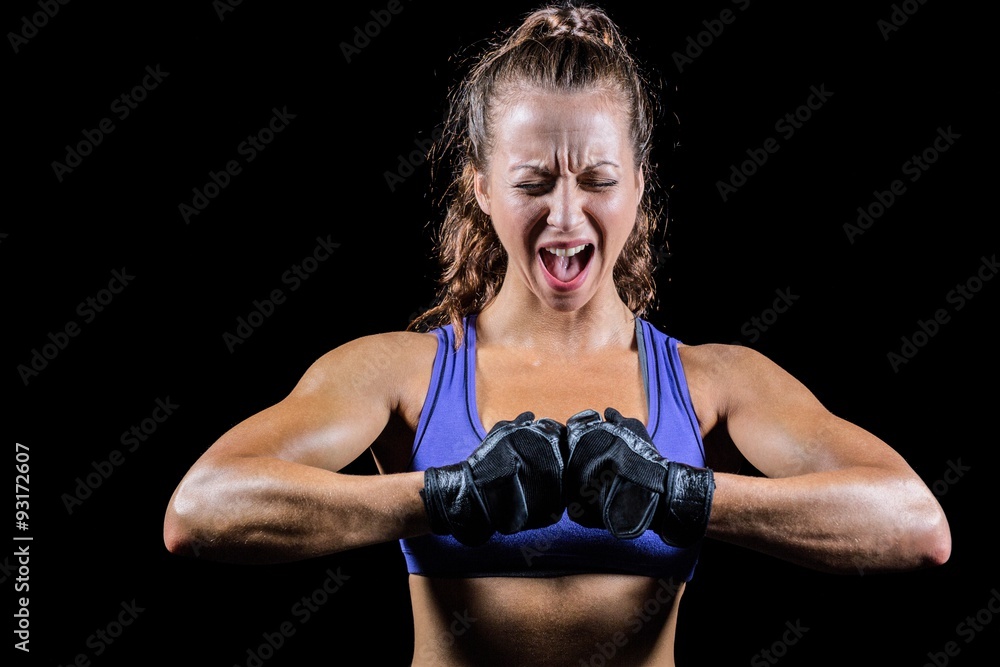 Aggressive female boxer flexing muscles Stock Photo | Adobe Stock