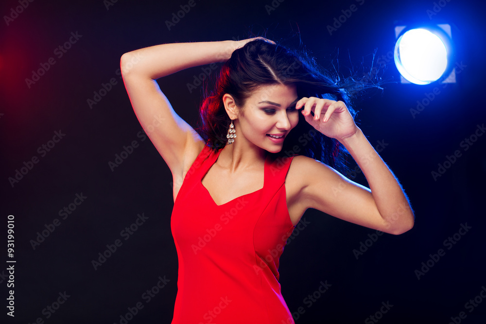 beautiful sexy woman in red dancing at nightclub Stock Photo | Adobe Stock
