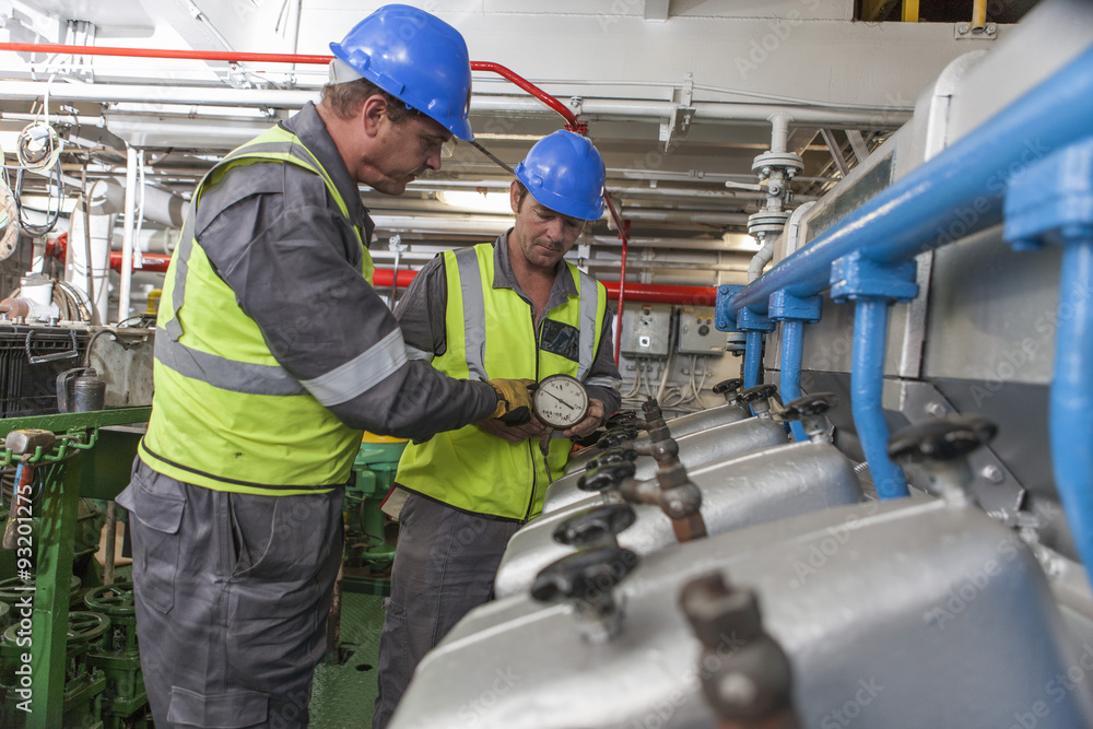 Crew working in engine room on a ship Stock Photo | Adobe Stock