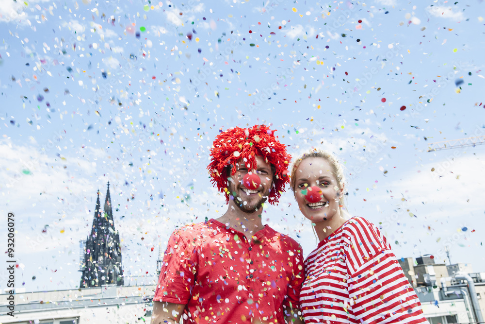 Germany, Cologne, young couple celebrating carnival dressed up as ...