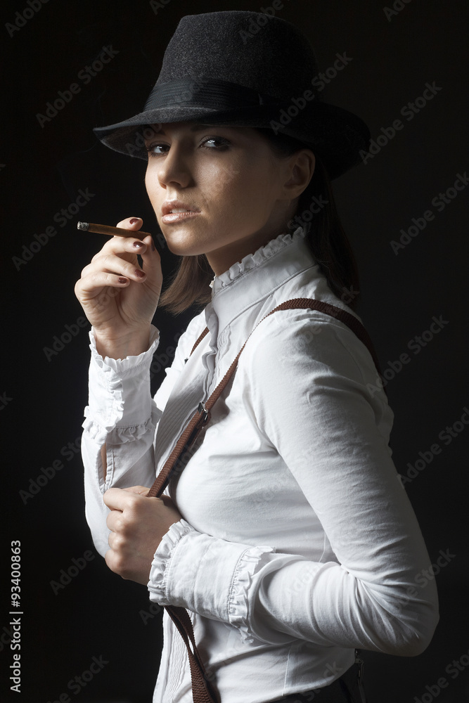 woman in hat smoking cigarette Stock Photo | Adobe Stock