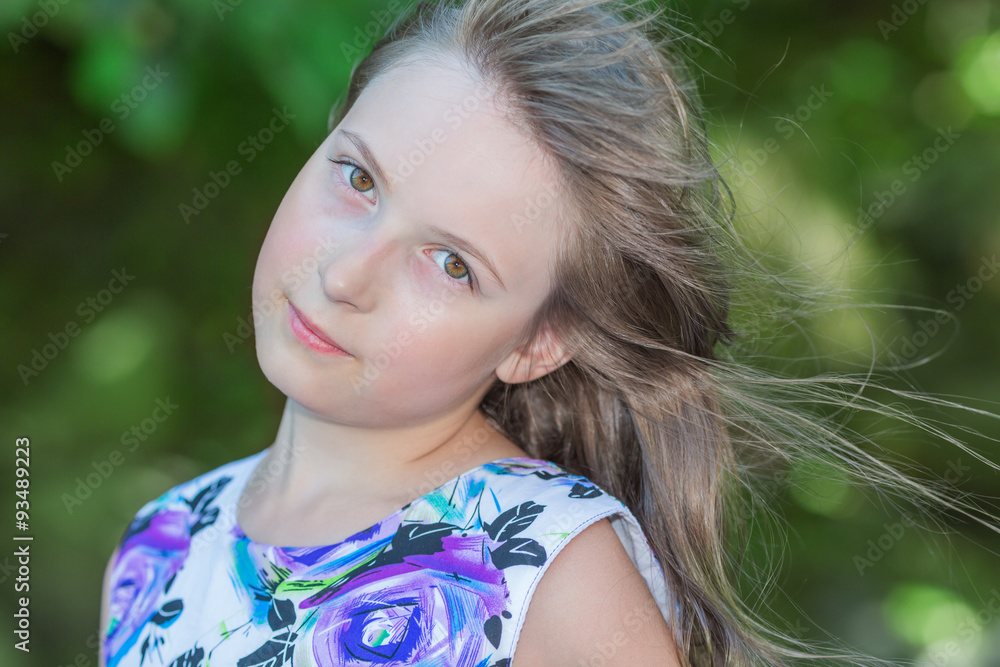 Cute preteen long hair girl posing on natural green background Stock ...