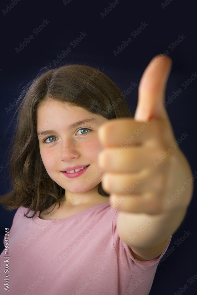 Portrait of beautiful little girl showing ok sign Stock Photo | Adobe Stock