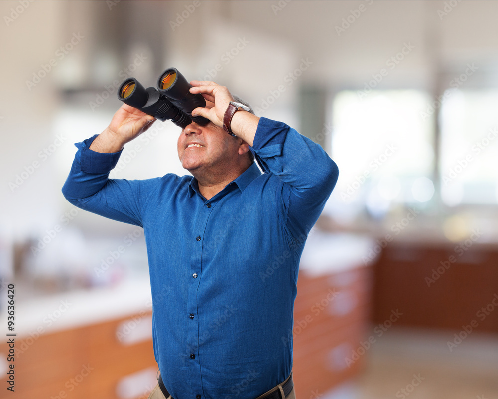 man using binoculars Stock Photo | Adobe Stock