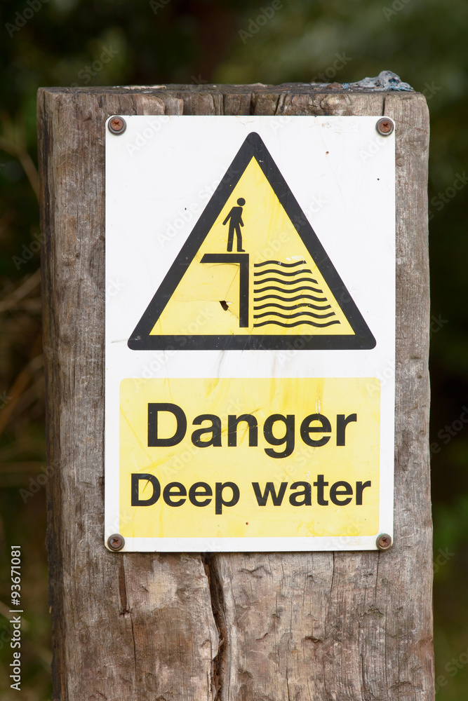 Danger Deep Water sign on wooden post besides river Stock Photo | Adobe ...