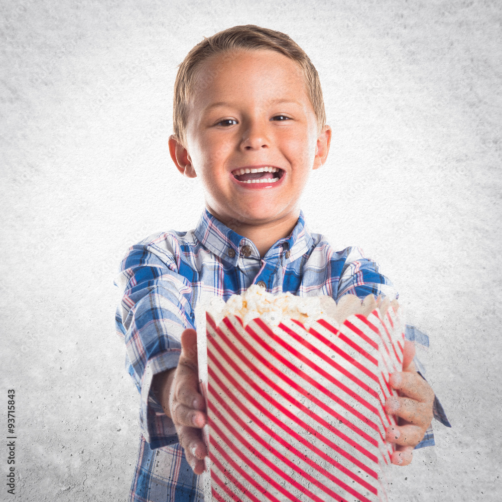 Kid with popcorn Stock Photo | Adobe Stock