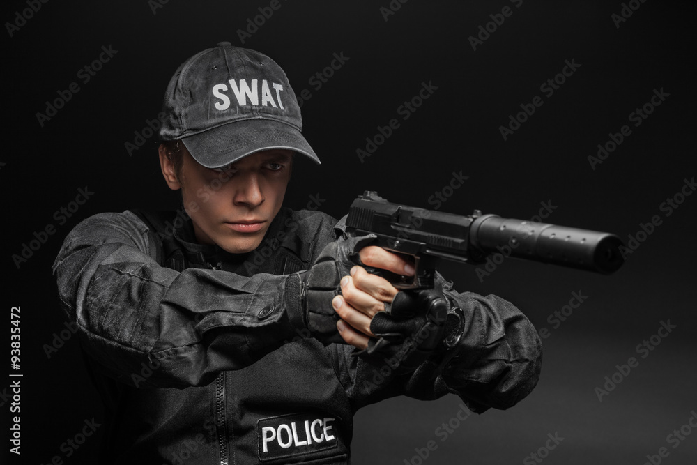 SWAT police officer with pistol Stock Photo | Adobe Stock