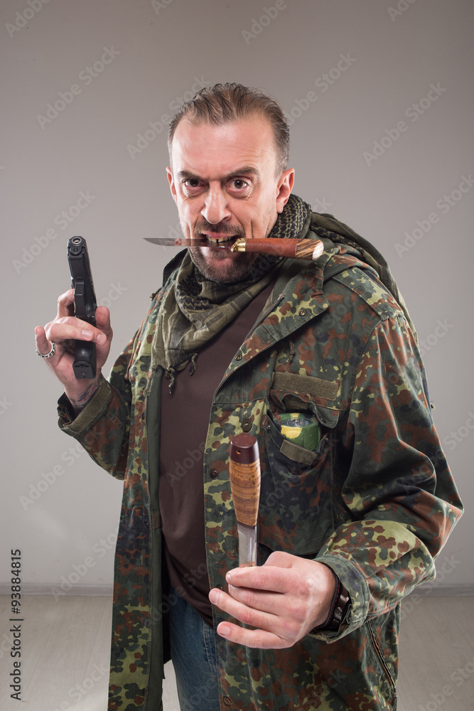 man in soldier uniform holding knife Stock Photo | Adobe Stock