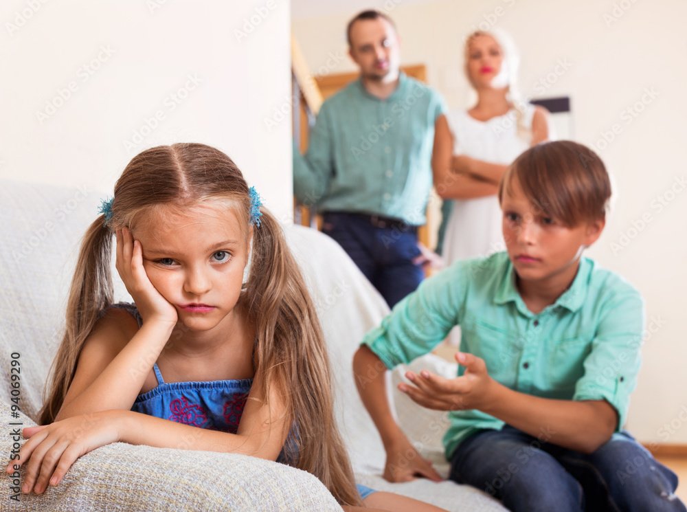 Brother calms angry sister Stock Photo | Adobe Stock