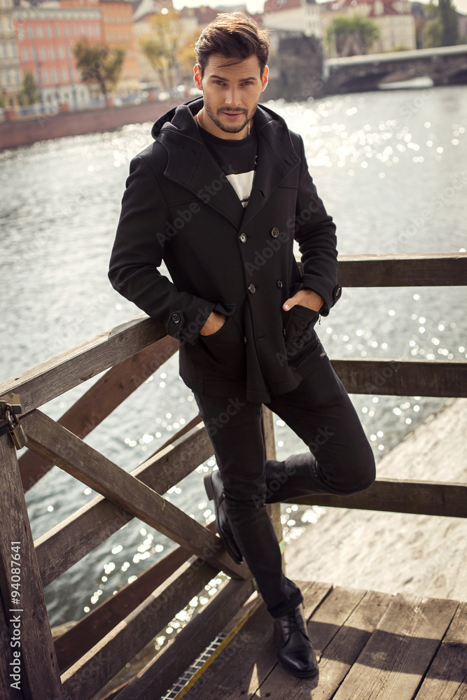 Young model in black coat Stock Photo | Adobe Stock