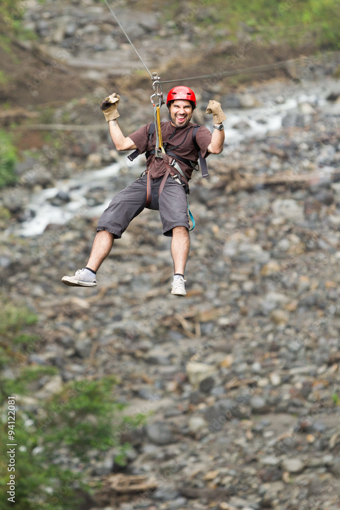 zipline zip line adult man zipline adventure in ecuadorian rainforest ...