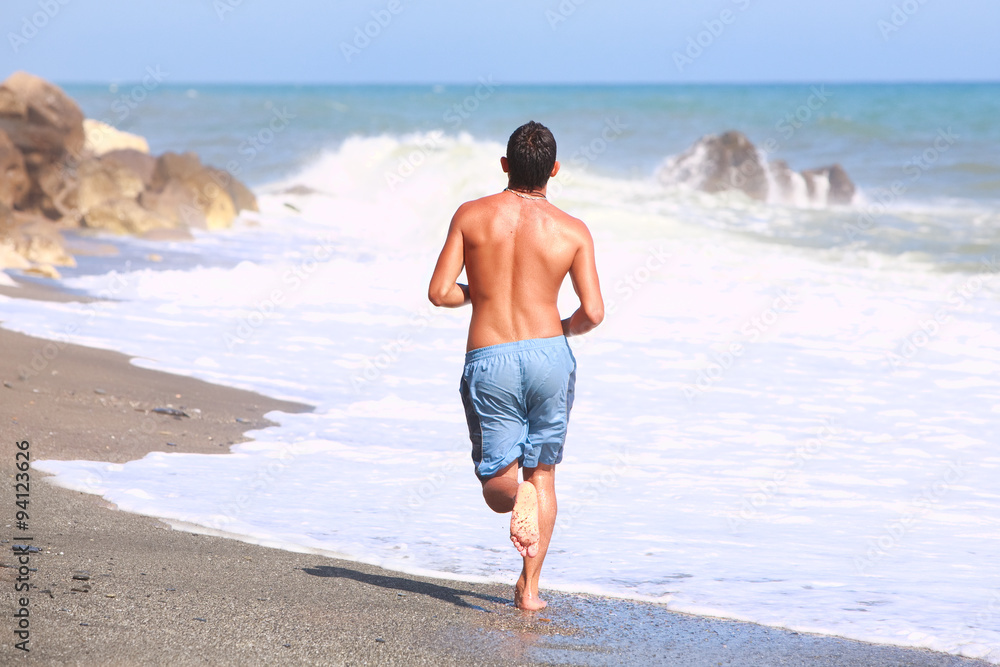 run back man sea man running through the beach in a beautiful summer ...
