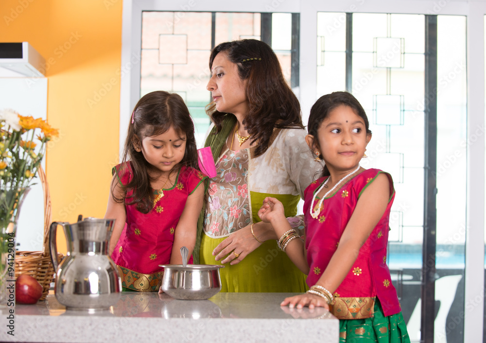 indian mother cooking with her daughters at kitchen Stock Photo | Adobe ...