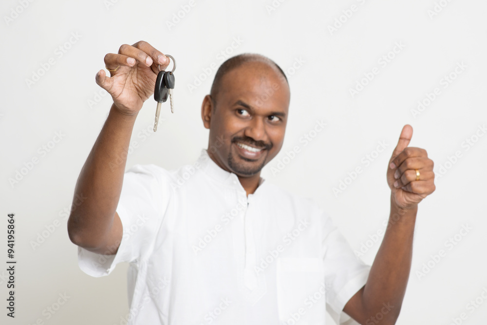 Indian man holding car key and thumb up Stock Photo | Adobe Stock