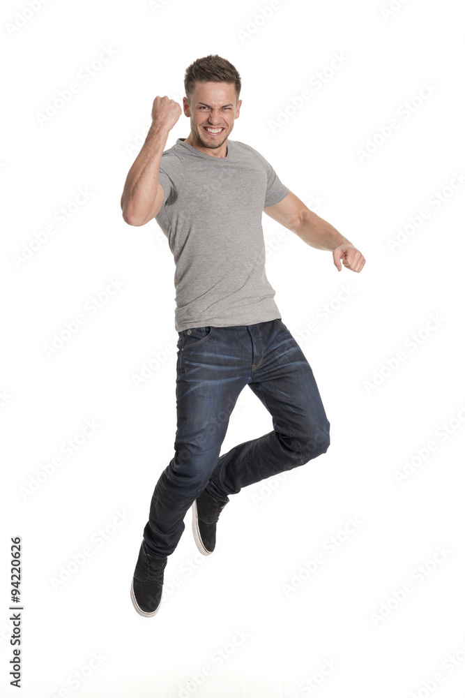 Junger Mann macht einen Freudensprung Stock-Foto | Adobe Stock