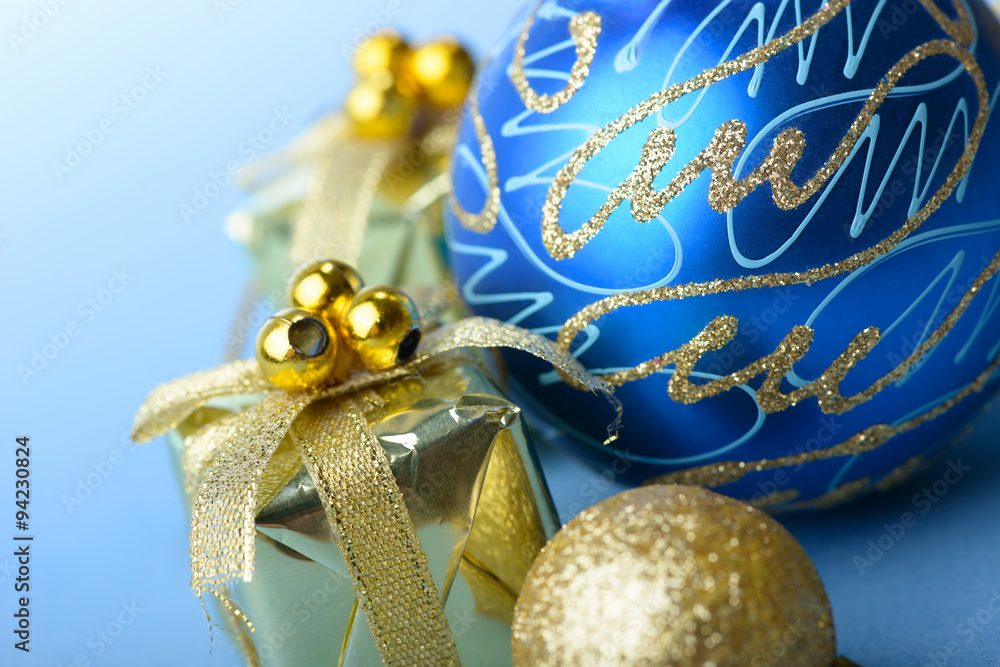 Christmas ball blue and gold with gift box present on blue background ...