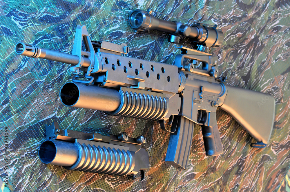 Assault rifle attached with grenade launcher. Stock Photo | Adobe Stock