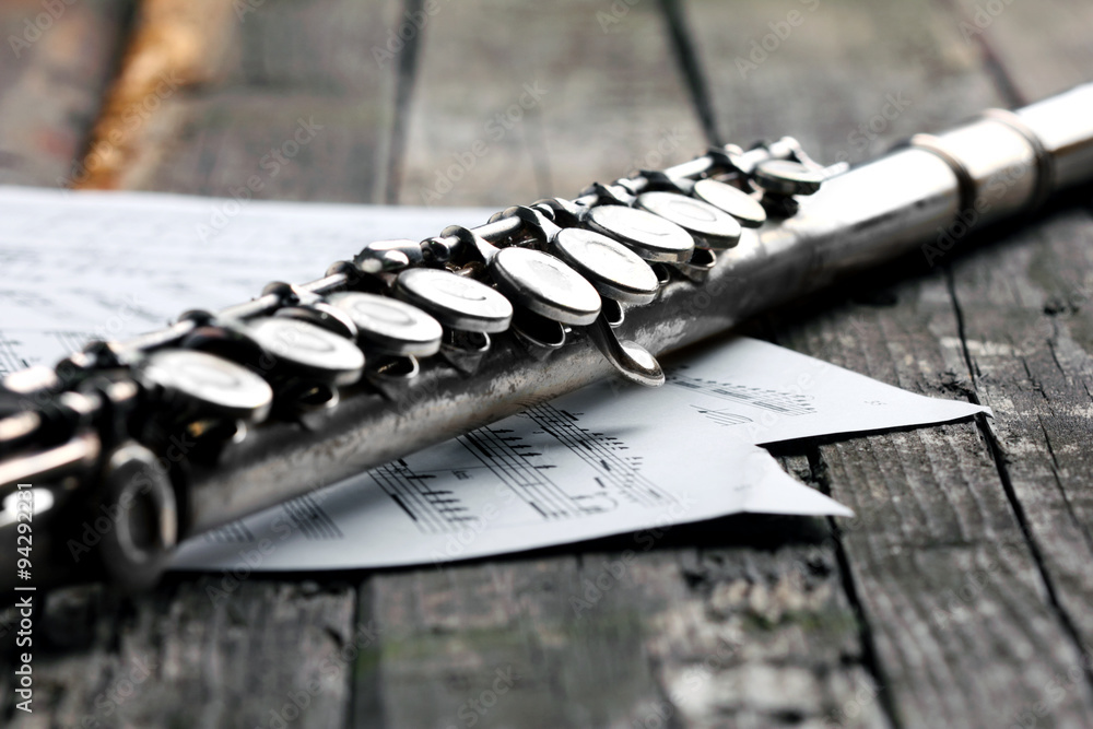 Old silver flute and music notes on rusty table Stock Photo | Adobe Stock
