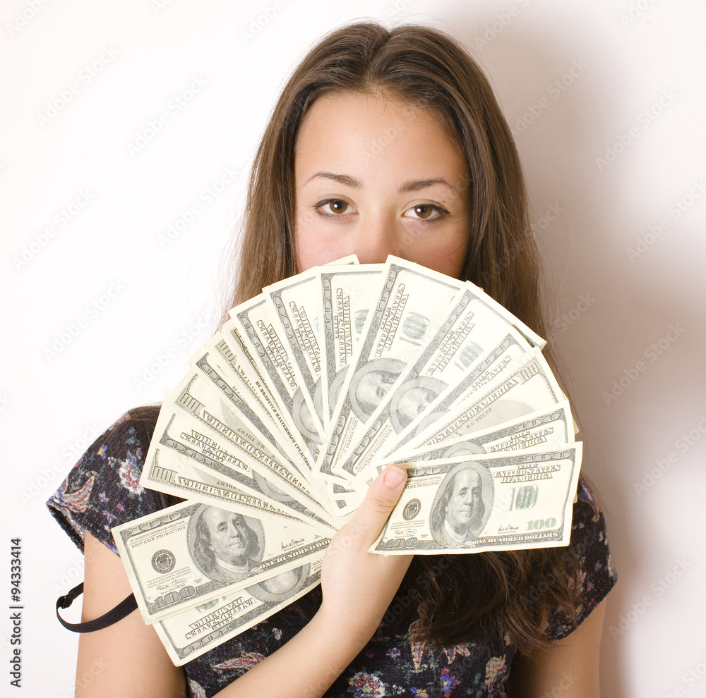 pretty young brunette woman with money cash isolated Stock Photo ...