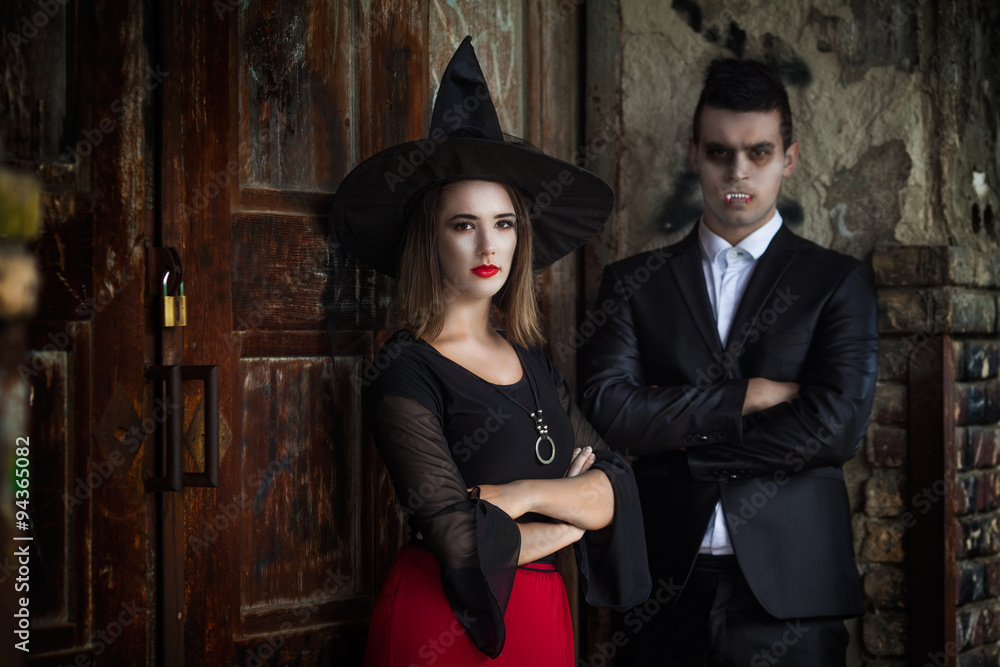 Vampire and the Witch standing in front of the door of the haunted ...